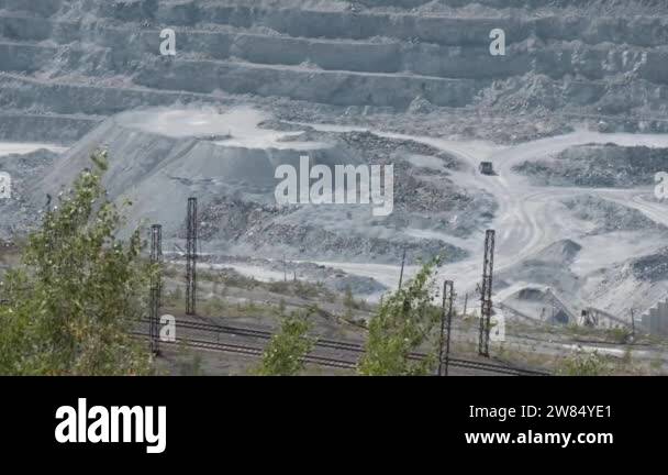 Asbestos quarry, a dump truck at work in open pit. Dump trucks, mining ...