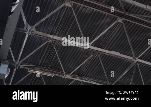 Ceiling of metal construction of a large modern room. Panorama of iron ...