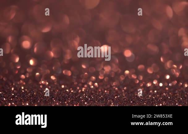 Abstract copper glitter background with moving and flicker particles ...