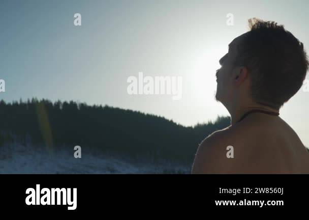 Close up view behind man breathing heavily while sitting outside in ...