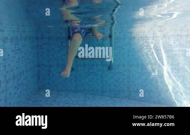 Larnaca, Cyprus - September 2021: A child dives into the pool. Summer ...