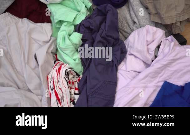 Pile of old used clothes. Disposal, recycling concept, donation ...