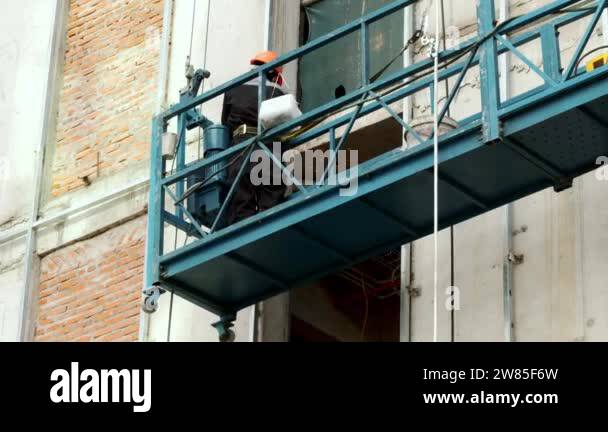 Industrial worker welding of metal structures, welder man male worker ...