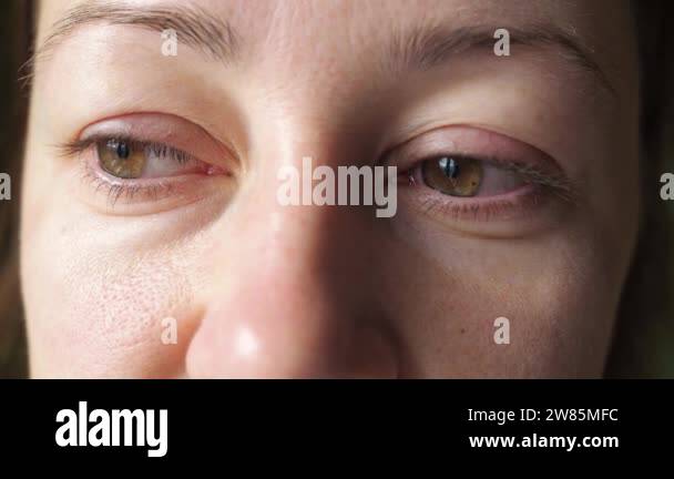 female eyes. closes and opens. no makeup, not much sleepy facial ...