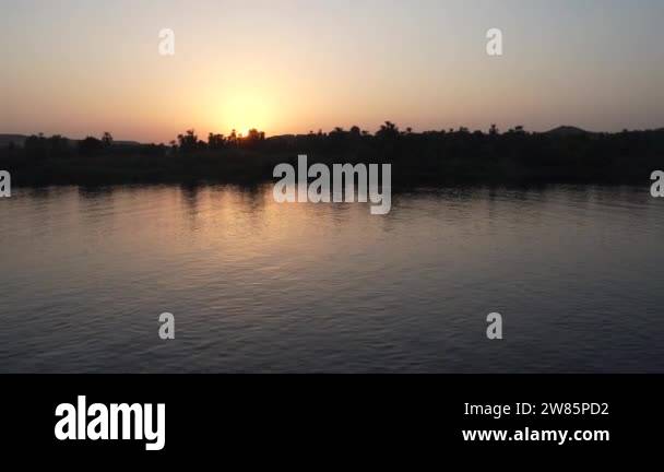 Twilight. The Nile River flows calmly. The setting sun rolls over the ...