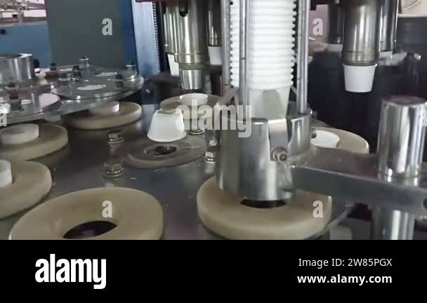 Paper cups are being made from paper, using paper cup manufacturing ...