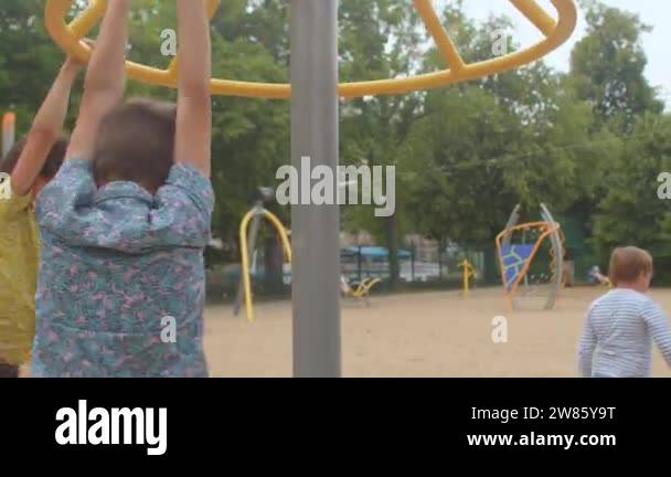 Boys spinning on the playground. Developing vestibular system Stock ...