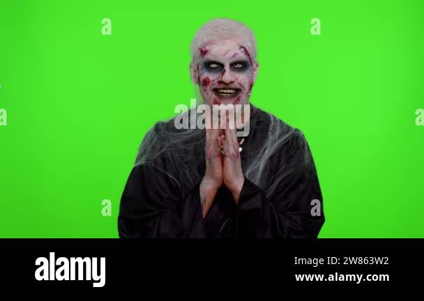 Sneaky cunning zombie Halloween man scheming evil plan, thinking over ...