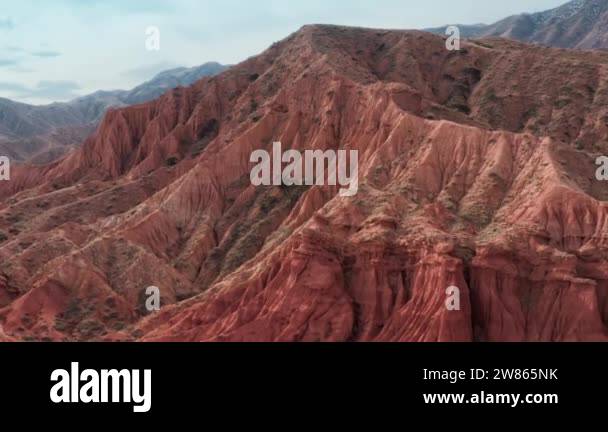 A fascinating flight through the peak of a huge red rock and the ...
