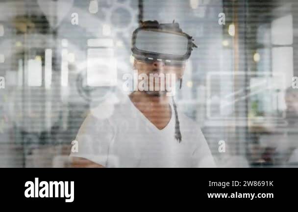 Animation of social media icons and data processing over african american man wearing vr headset ...