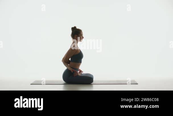 Yoga class advertisement. Fit slim young girl sit in lotus pose ...
