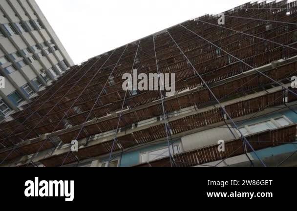 Scaffolding to the side of a high-rise residential building ...