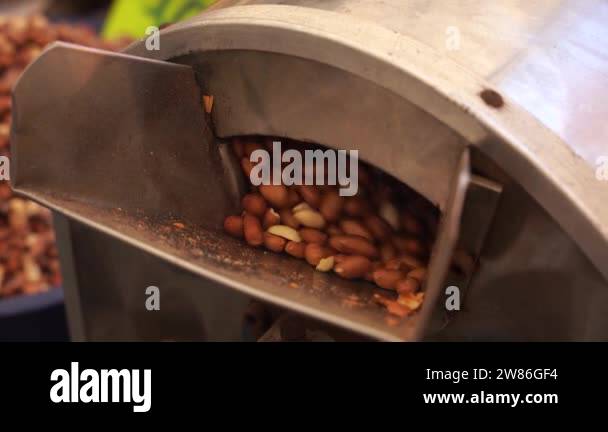 Roasting and blanching peanuts 4k video. Process of peeling peanuts in machine Stock Video ...