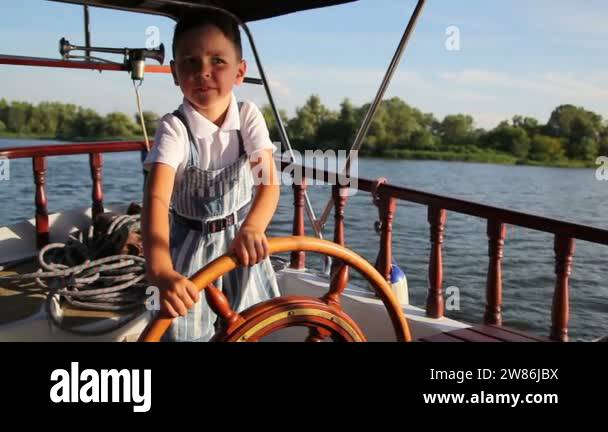 Boy driving boat Stock Videos & Footage - HD and 4K Video Clips - Alamy