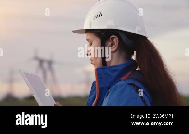 Civil engineer, power engineer woman in protective helmet, building and ...