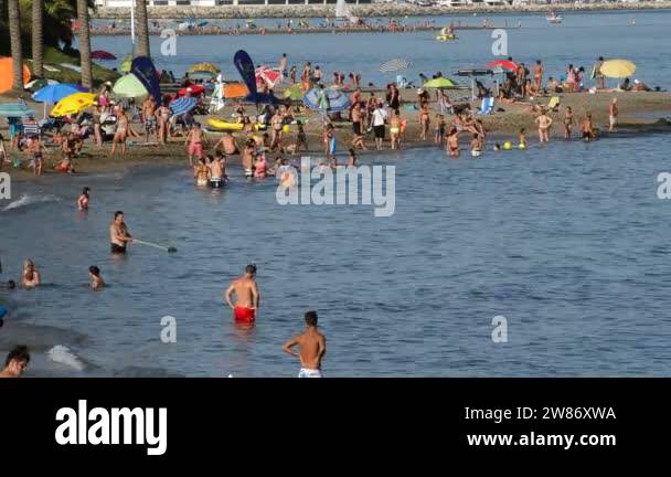 Beaches of southern Spain and swimmers crowded on a summer afternoon ...