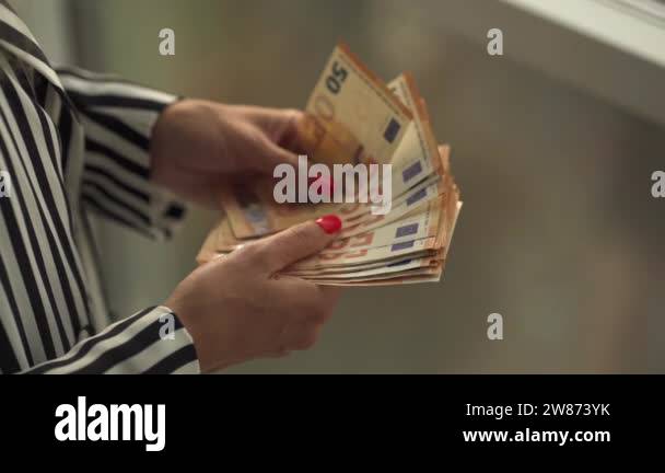 A rich woman counting many euro banknotes. Concept of wealth, online ...