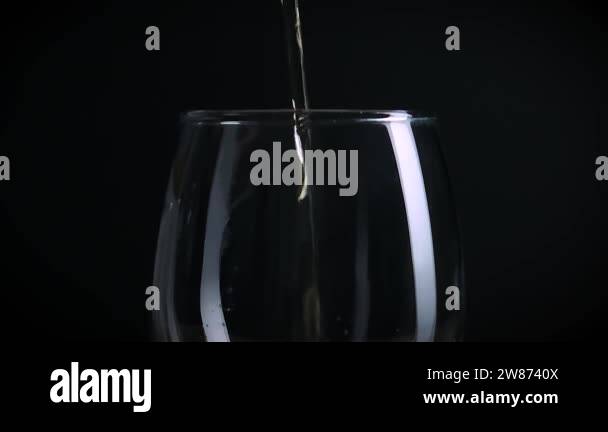 Beer glass filling with golden lager beverage in slow motion video clip ...