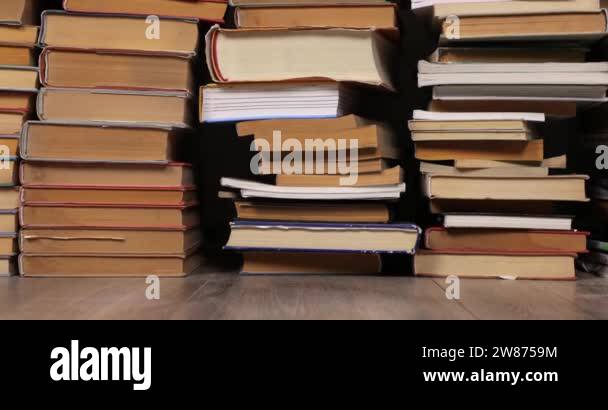 Books pile messy Stock Videos & Footage - HD and 4K Video Clips - Alamy