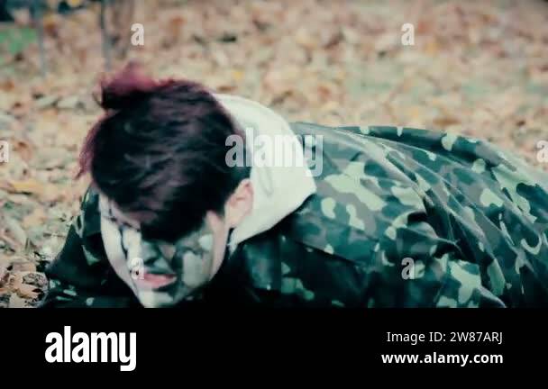 Scary man in military uniform crawling in forest, zombie invasion ...
