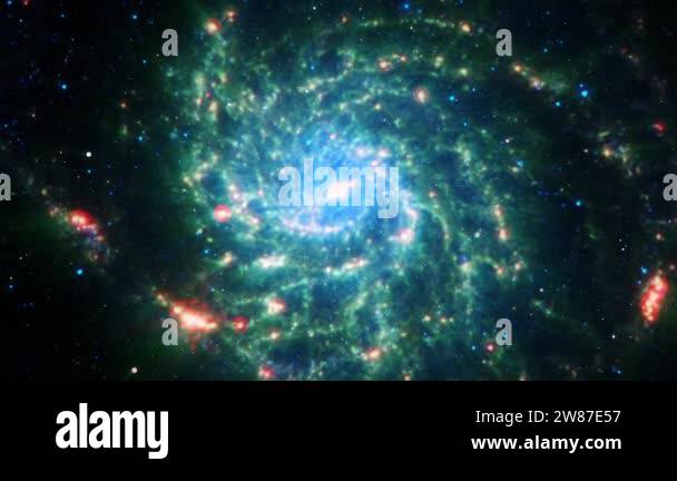 Seamless loop galaxy exploration through outer space towards glowing ...