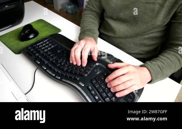 European man learns typing an email on keyboard shows learning the ten ...