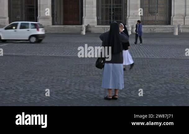 A nun poses for a picture in Piazza San Giovanni Stock Video Footage ...