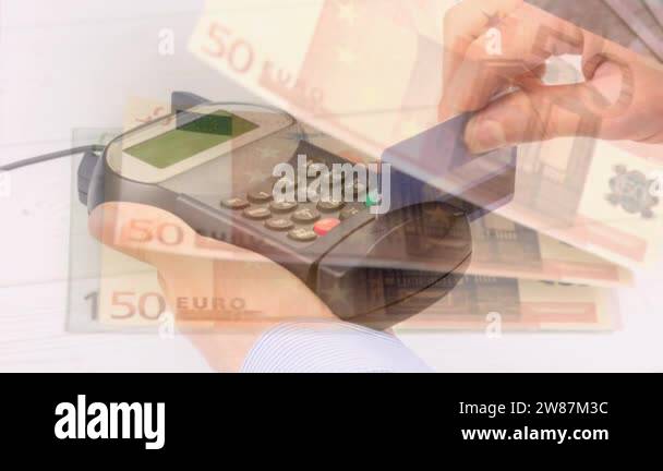 Animation of euro banknotes falling over hand of caucasian man holding ...