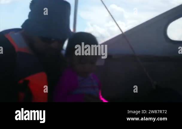 Tourists island hopping in Malaysia. Travelling by speed boat. Asian ...