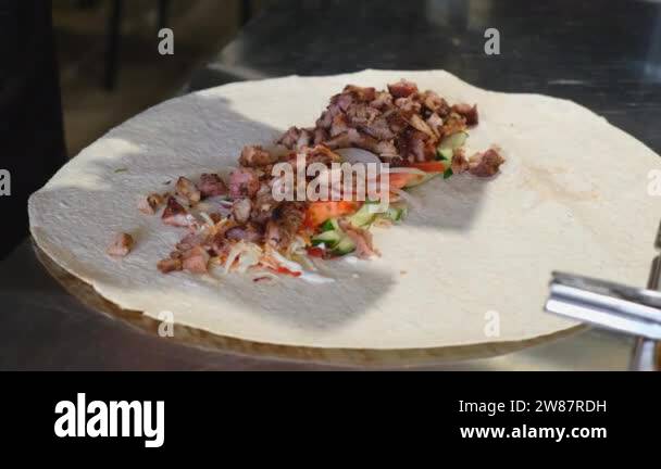 Process of cooking shawarma. Chicken shawarma cooking in restaurant ...
