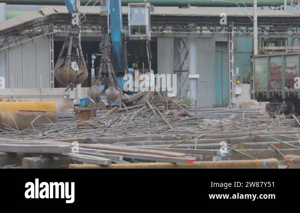 Recycling metal waste, metal recycling yard. Excavator with grab ...