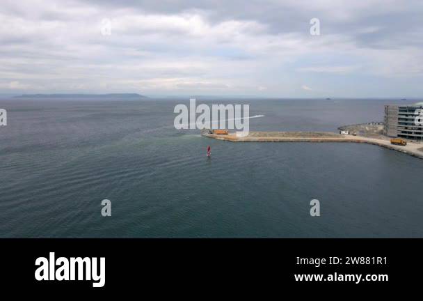 Aerial video. View from abobe and excavator working on building a land ...
