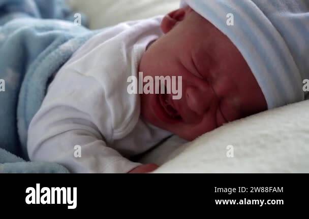 Close-up Crying Newborn Baby Face Portrait Early Days Sleeping On Tummy ...