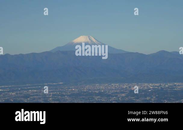 Tokyo, Japan circa-2018. Zoom out from Mount Fuji to reveal city of ...