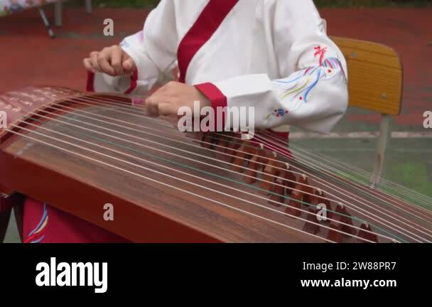 Chinese girl playing traditional musical instrument Stock Videos ...