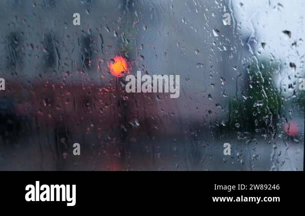 Rain Drops Falling on window with bokeh light effects. Heavy rain ...