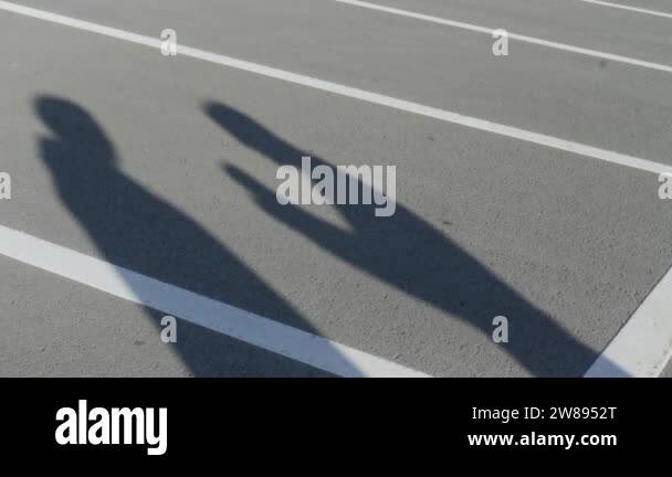 The silhouettes of two young men during angry conflict. HDR. Shadows of ...