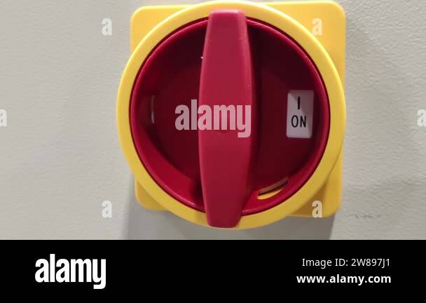 The hand turns on the red switch. The hand turns the red switch ...