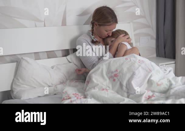 Mom Presses Her Daughter Of Five Years To Her Chest And Gently Strokes