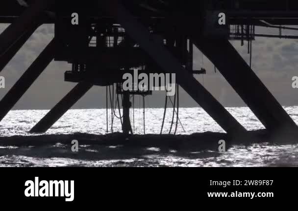 Moonpool of rig. Side view. Silhouette. Bottom of offshore drilling ...