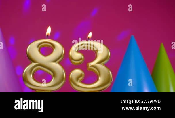 Burning birthday cake candle number 83. Happy Birthday background ...