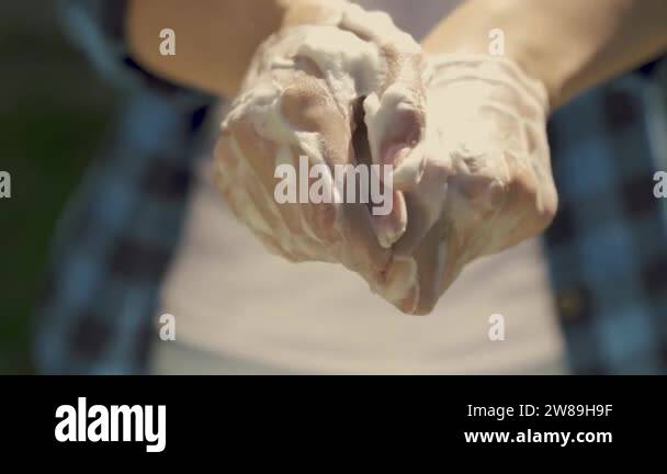 wash hands with soap close-up, foam the gel to remove dirt, cleanse the ...