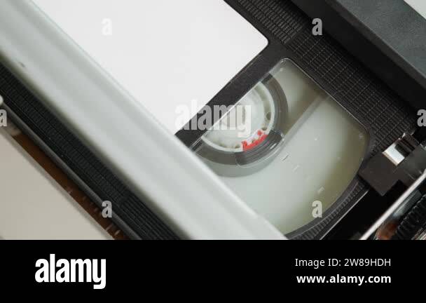 Video Cassette Tape. Inside, slowly, rotates reel with the film ...