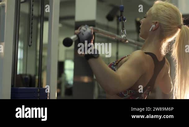 Close-up, slow motion, side view footage of a young blonde lady with ...