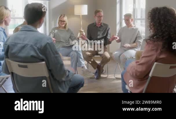 Young People Holding Hands Together During Group Therapy. Feeling ...