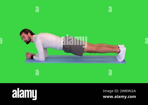 Fitness man doing planking exercise on a Green Screen, Chroma Key Stock ...
