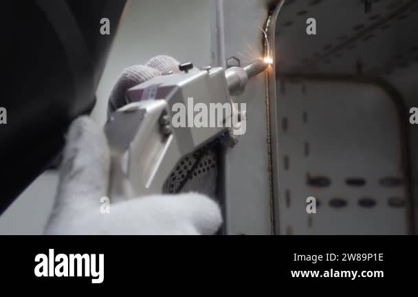 Closeup machine welding metal parts. Welder work welding torch flame ...