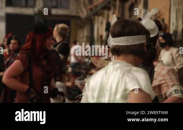 people are having fun. women dressed in ancient clothes of wartime ...