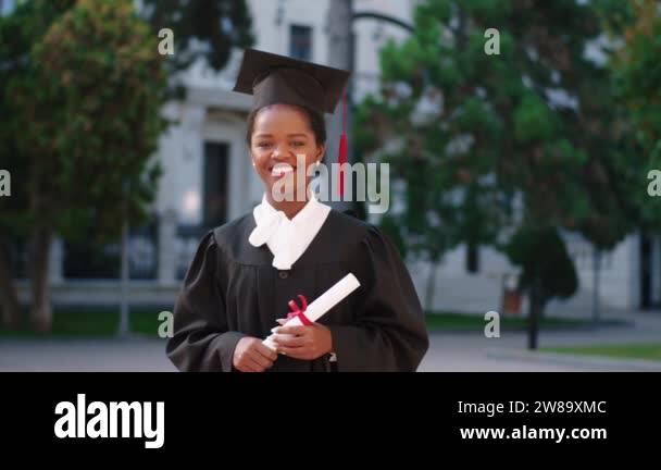 Graduation concept amazing looking black lady graduate posing with her ...