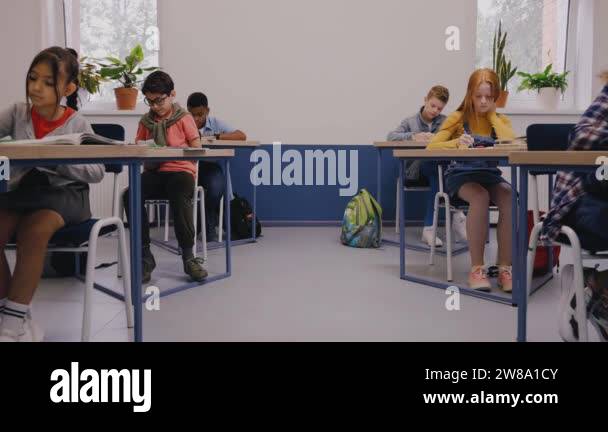 Girl passing note in classroom Stock Videos & Footage - HD and 4K Video ...